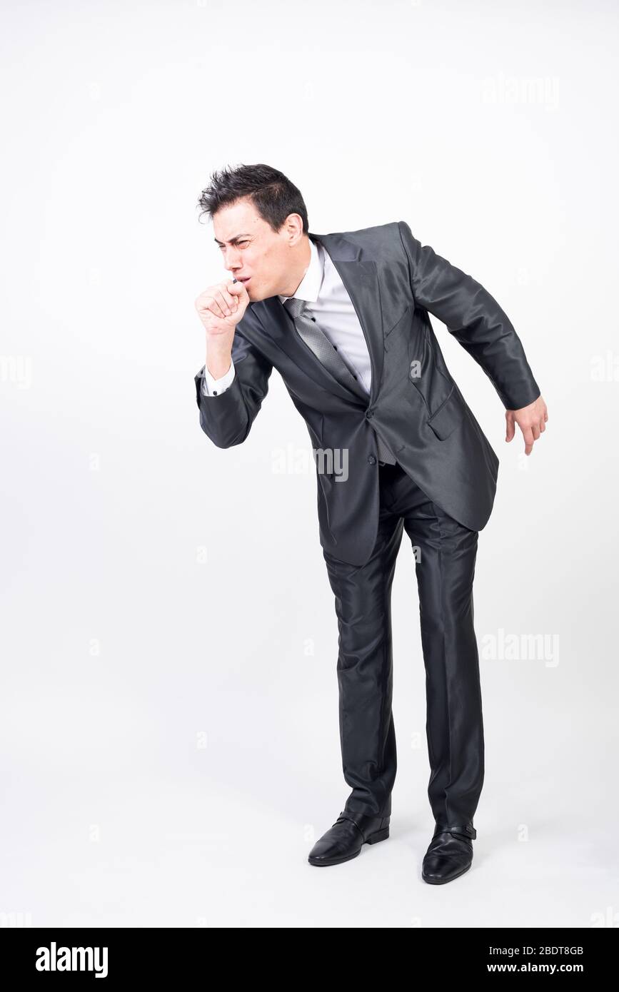 Man in suit coughing. White background. full body Stock Photo - Alamy