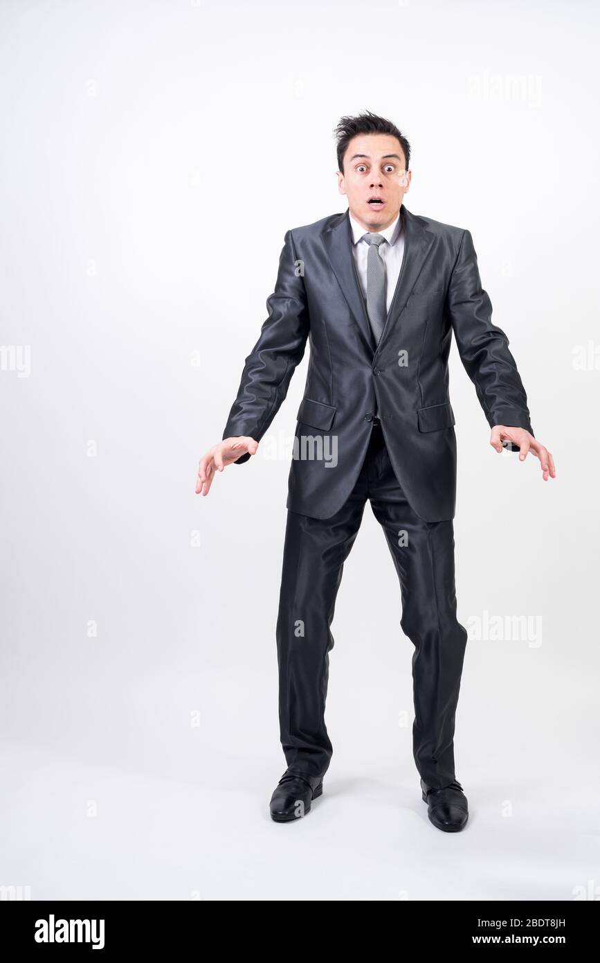 Scared man in suit on white background, full body Stock Photo - Alamy