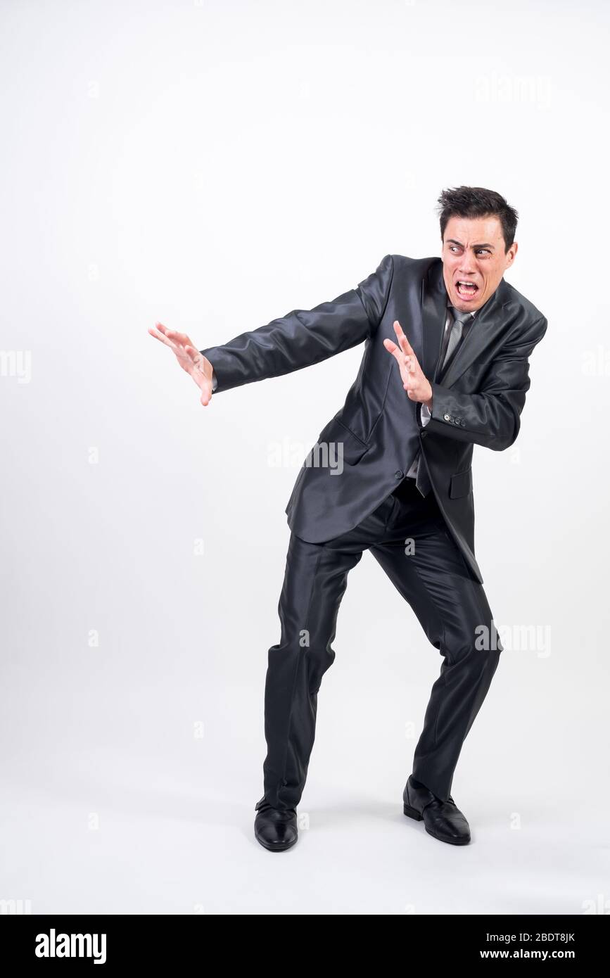 Scared man in suit on white background, full body Stock Photo - Alamy