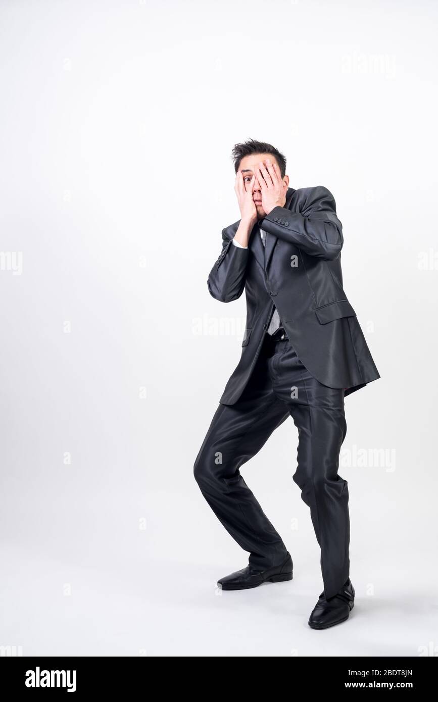 Scared man in suit on white background, full body Stock Photo - Alamy