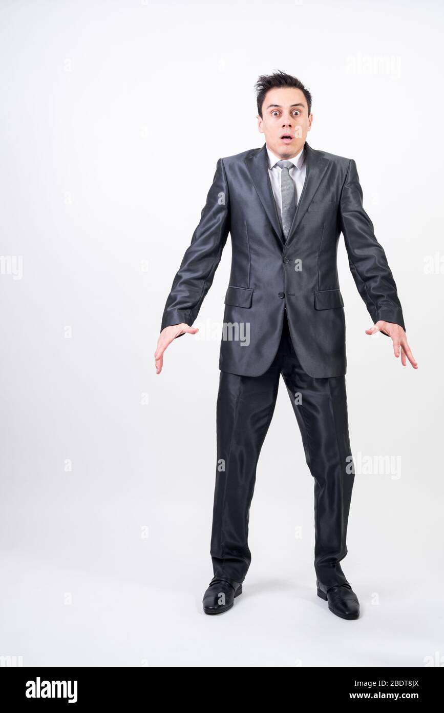 Scared man in suit on white background, full body Stock Photo - Alamy