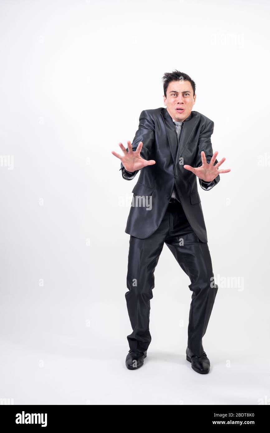 Scared man in suit on white background, full body Stock Photo - Alamy