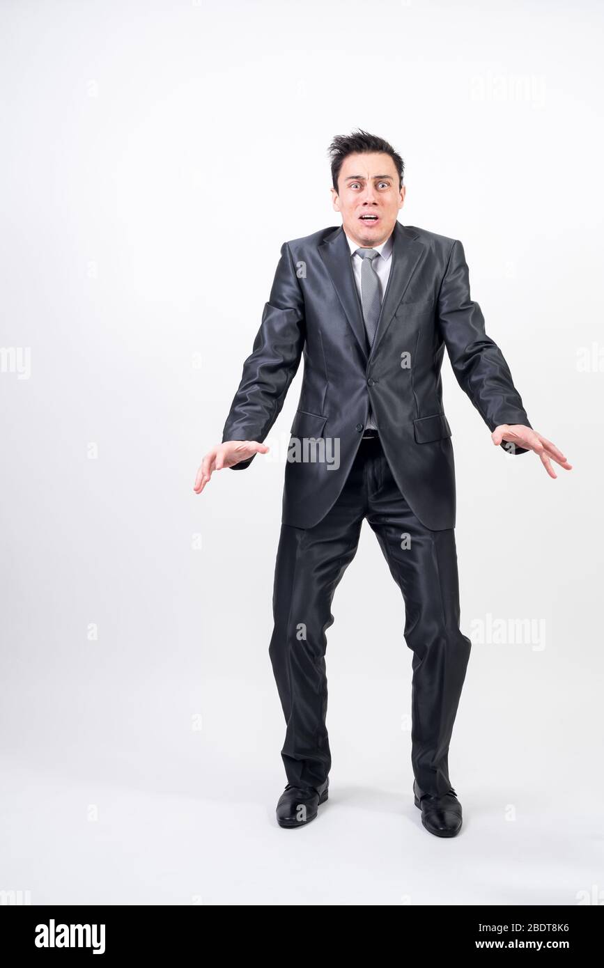 Scared man in suit on white background, full body Stock Photo - Alamy