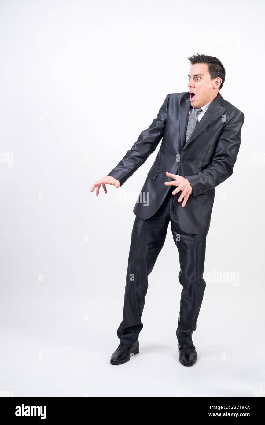 Scared man in suit on white background, full body Stock Photo - Alamy