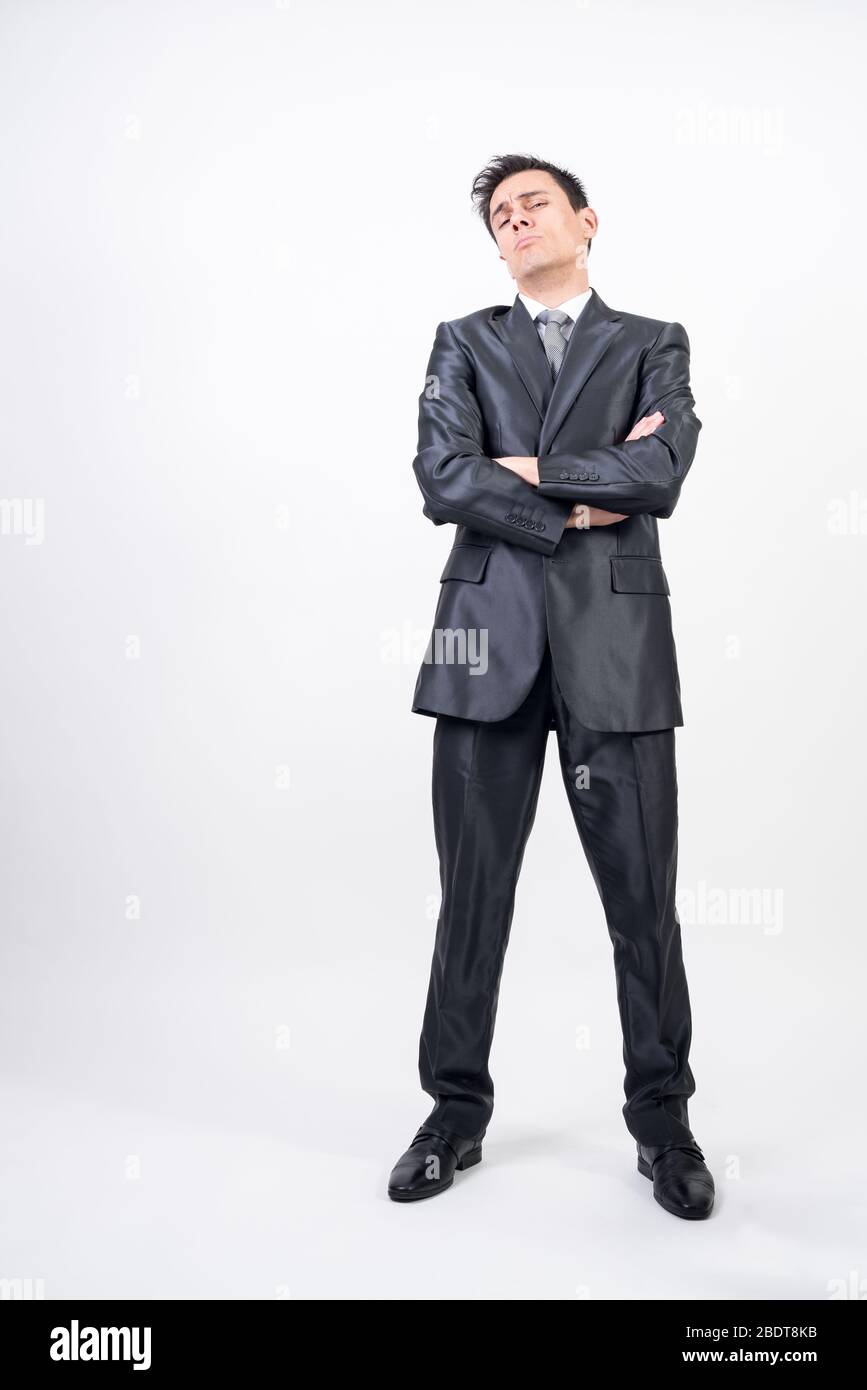 Self-confident man in suit. White background, full body Stock Photo - Alamy
