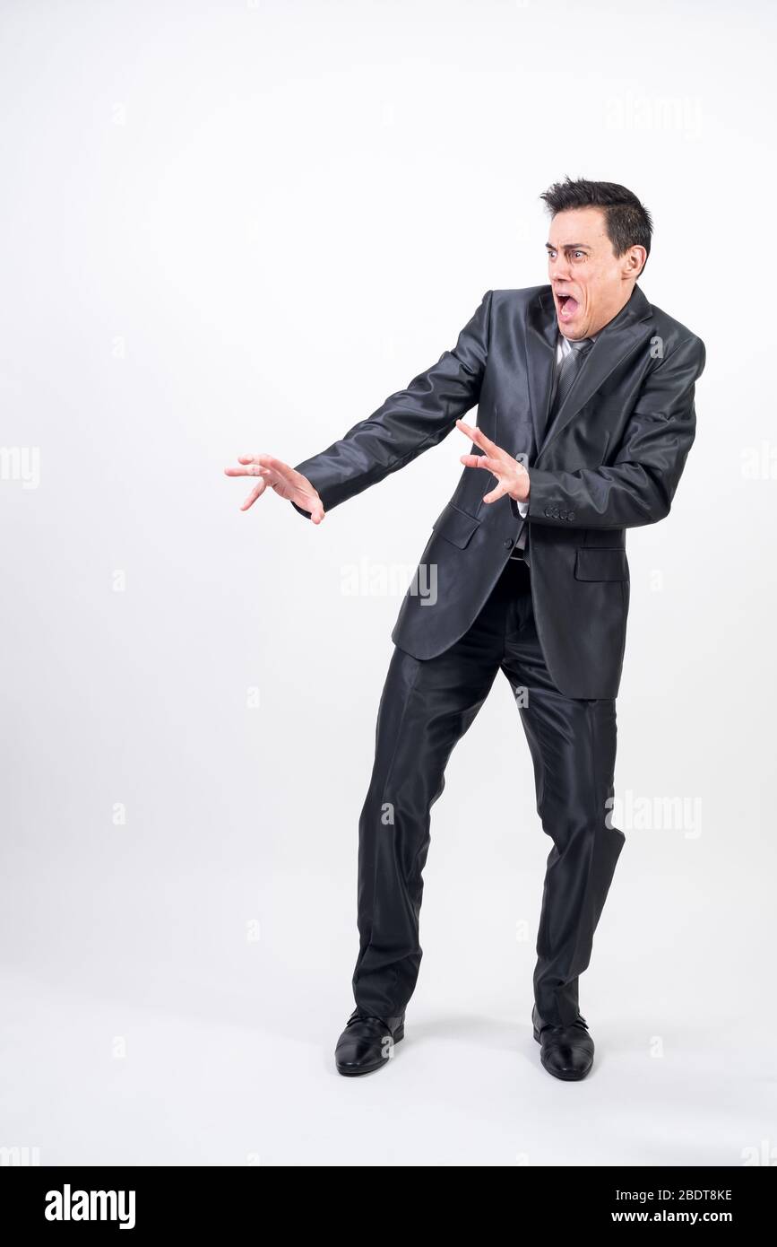 Scared man in suit on white background, full body Stock Photo - Alamy