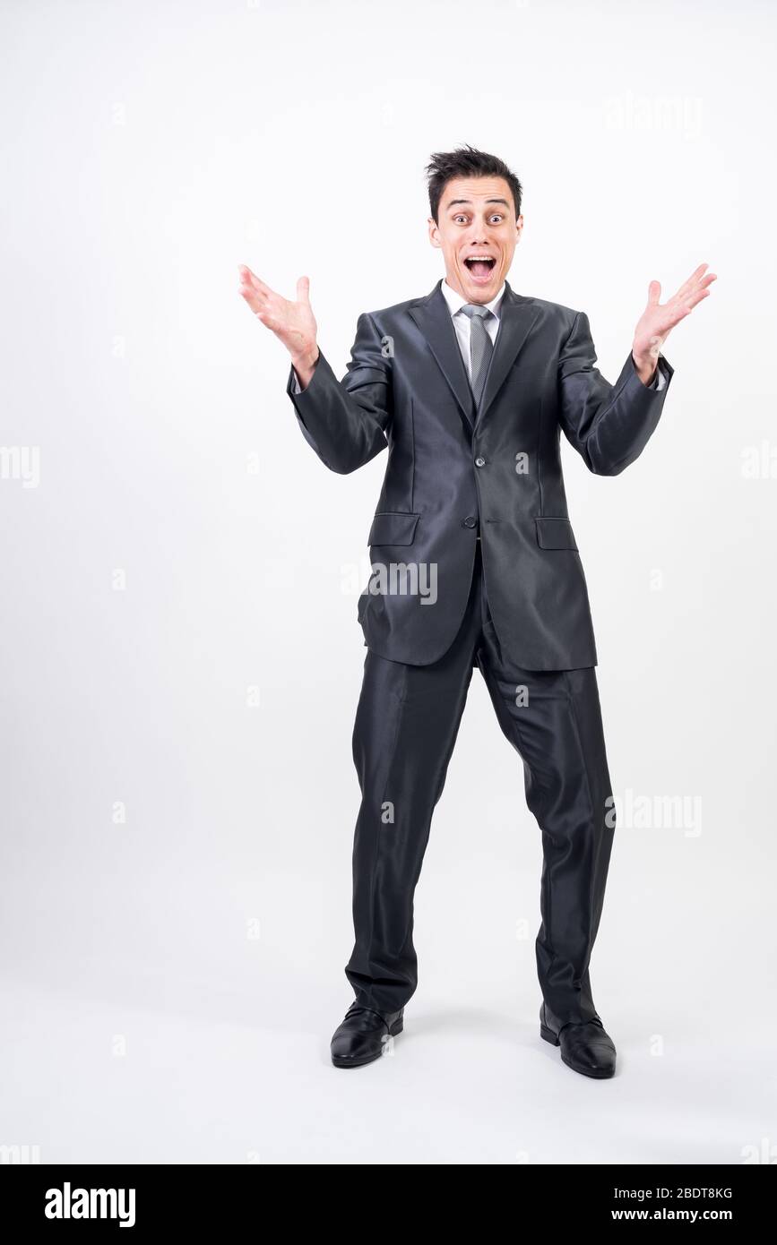 Euphoric man in suit celebrating something. White background. Full body ...