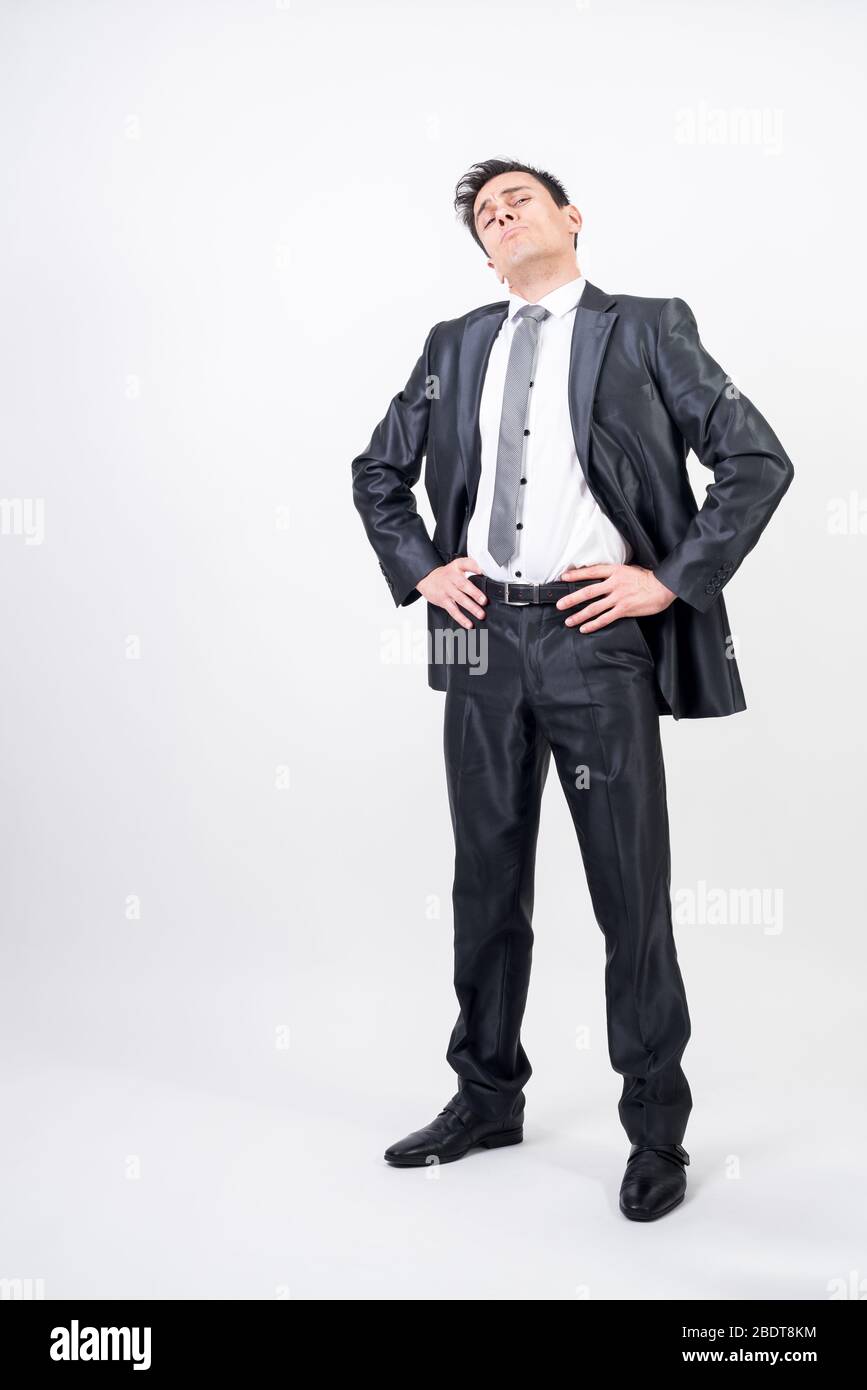 Self-confident man in suit. White background, full body Stock Photo - Alamy