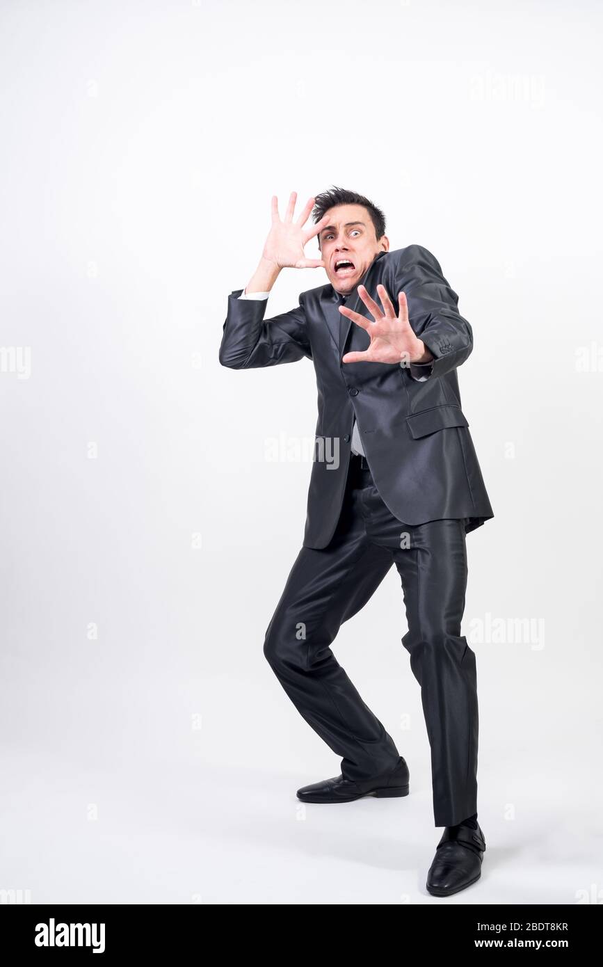Scared man in suit on white background, full body Stock Photo - Alamy