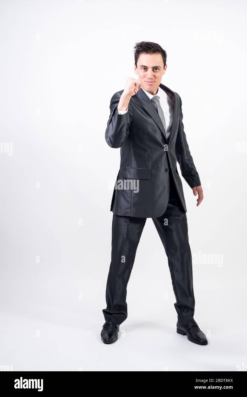 Euphoric man in suit celebrating something. White background. Full body ...