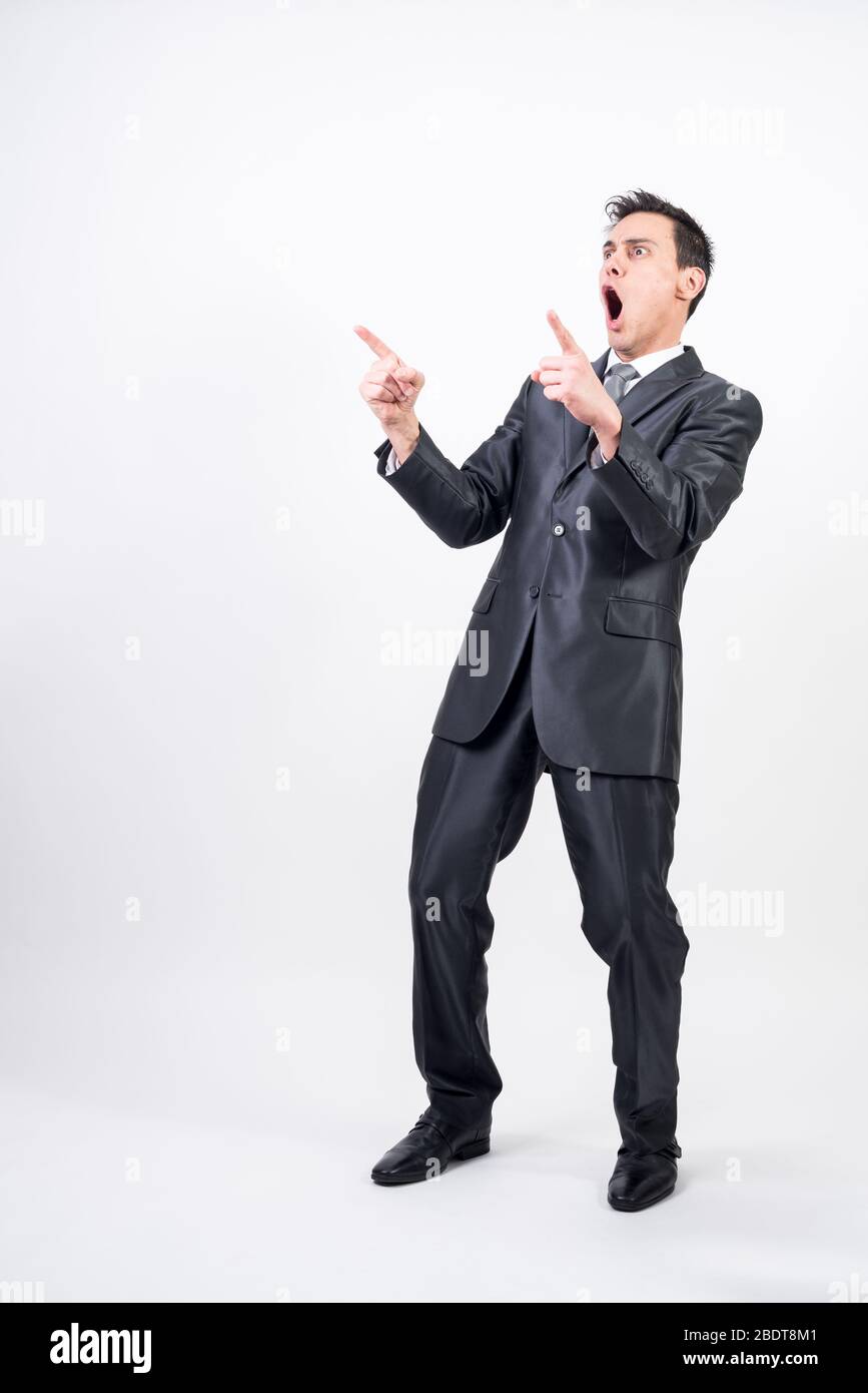 Euphoric man in suit celebrating something. White background. Full body ...