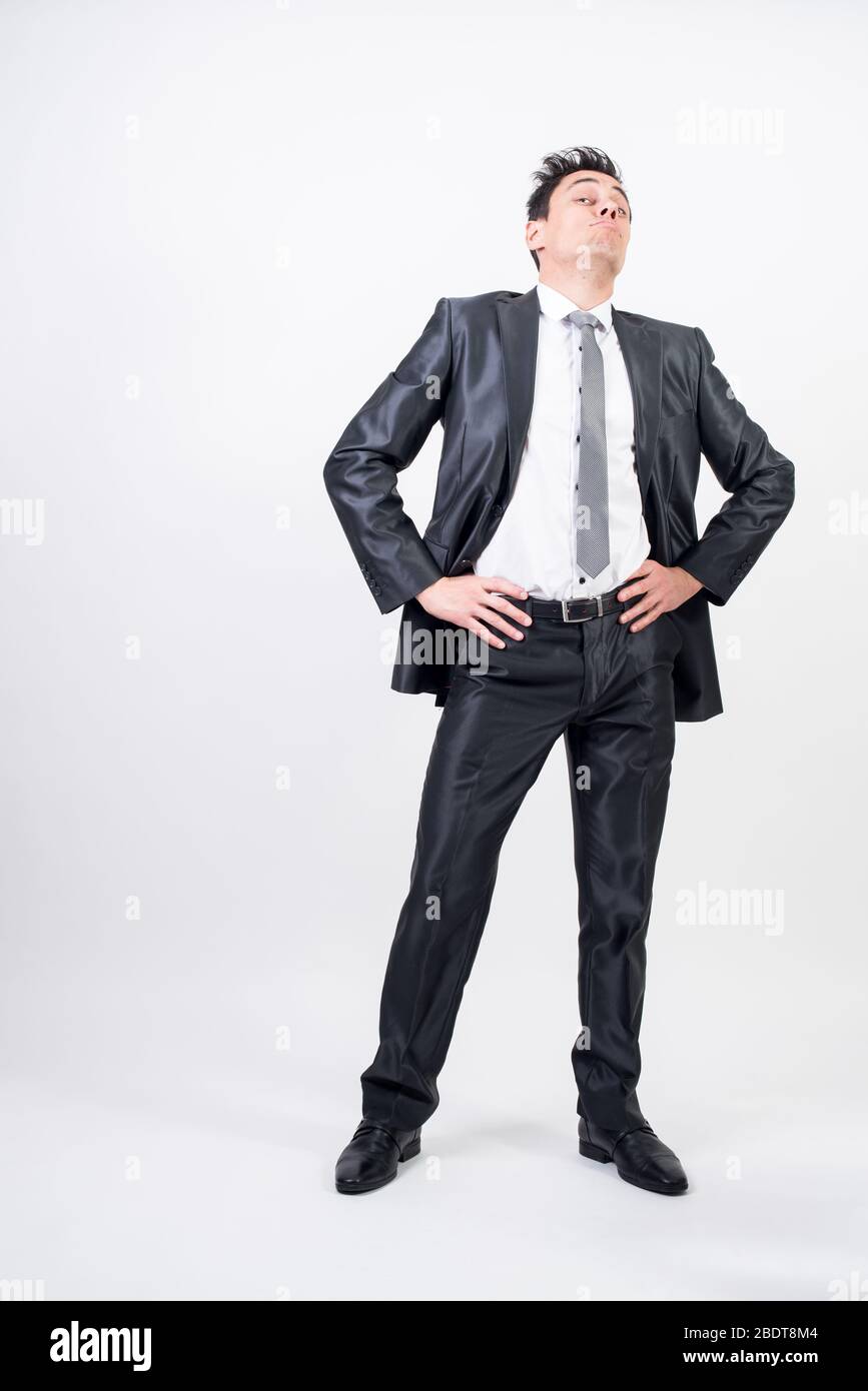 Self-confident man in suit. White background, full body Stock Photo - Alamy