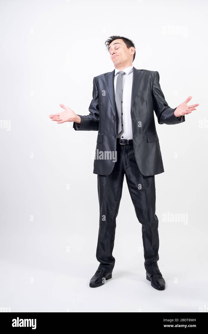 Self-confident man in suit. White background, full body Stock Photo - Alamy