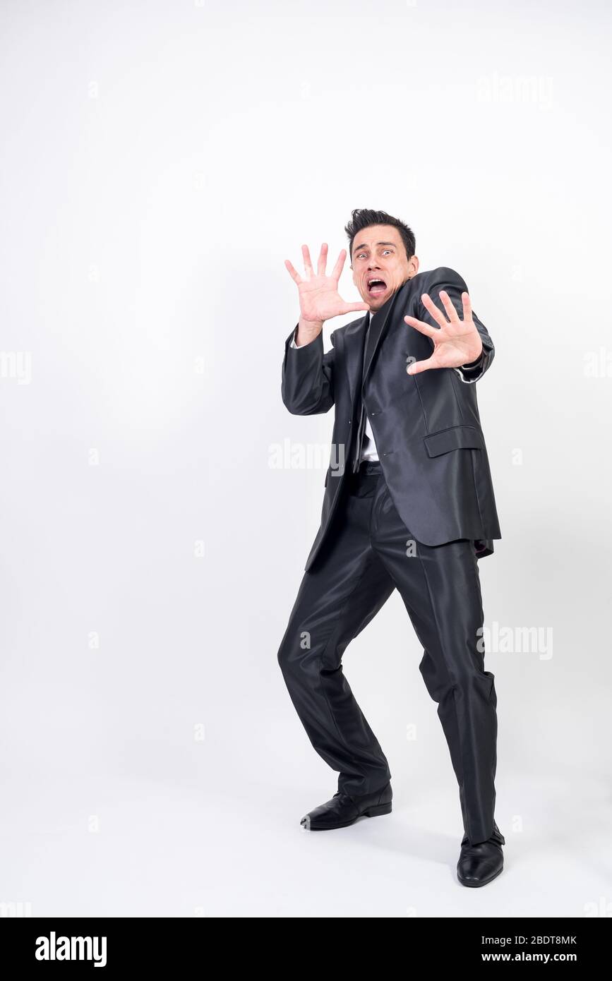 Scared man in suit on white background, full body Stock Photo - Alamy
