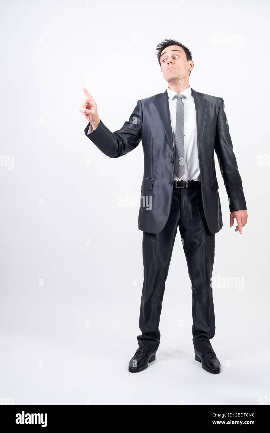 Challenging man in suit. White background. Full body Stock Photo - Alamy