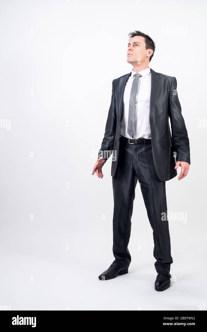 Self-confident man in suit. White background, full body Stock Photo - Alamy