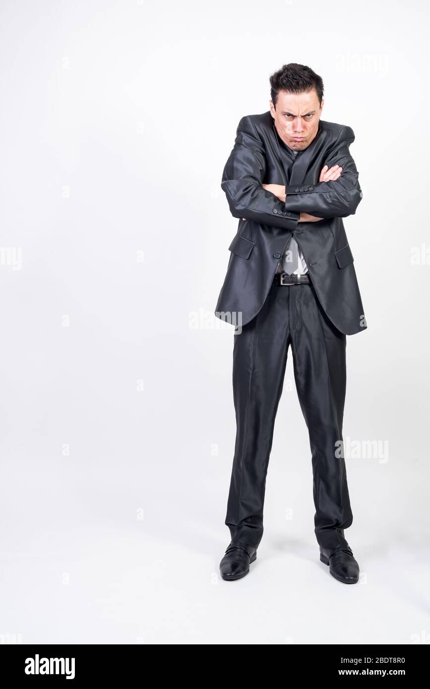 Angry man in suit. white background, full body Stock Photo - Alamy