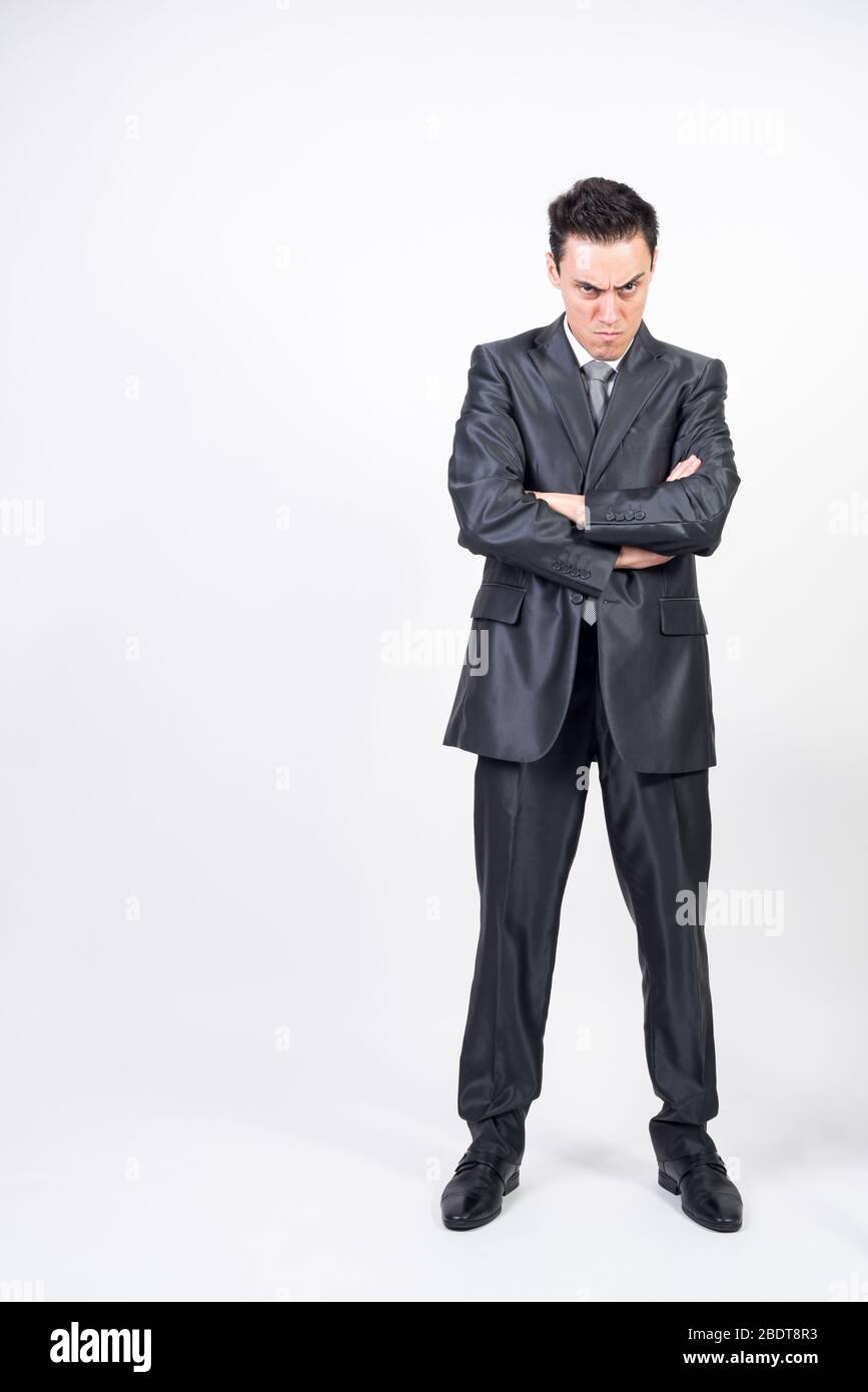 Angry man in suit. white background, full body Stock Photo - Alamy
