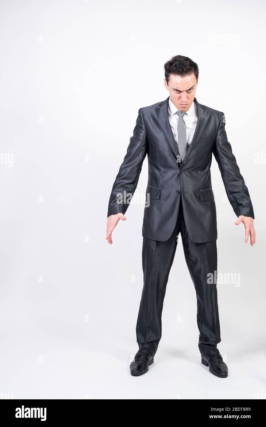 Angry man in suit. white background, full body Stock Photo - Alamy