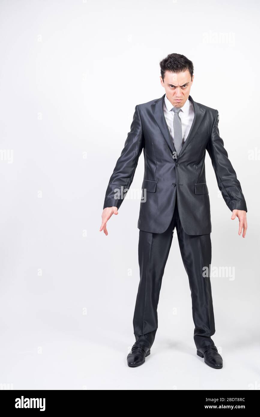 Angry man in suit. white background, full body Stock Photo - Alamy