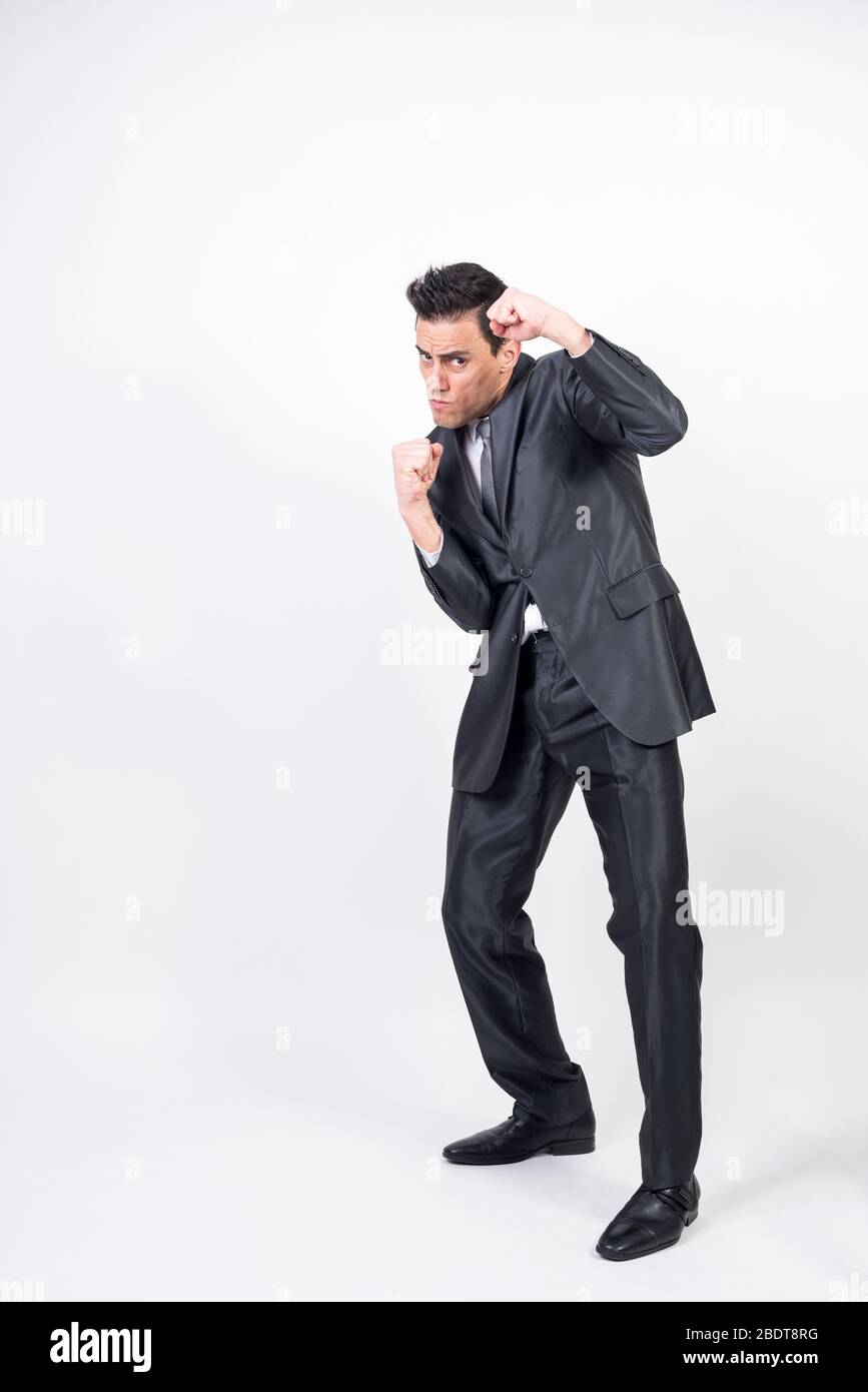 Angry man in suit. white background, full body Stock Photo - Alamy