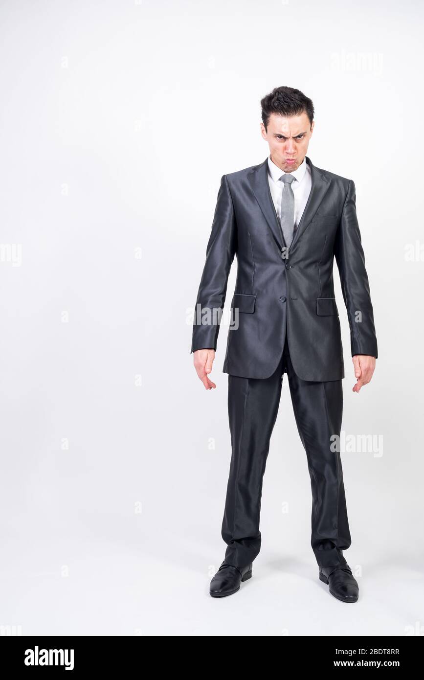 Angry man in suit. white background, full body Stock Photo - Alamy