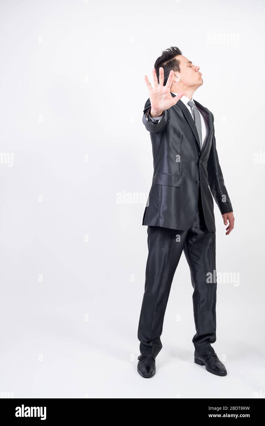 Angry man in suit. white background, full body Stock Photo - Alamy