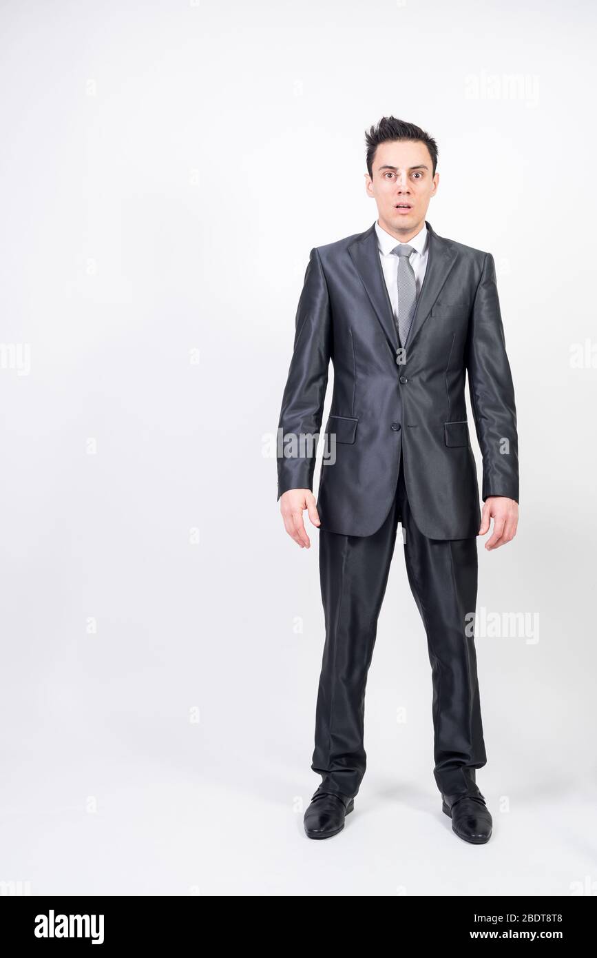 Man in suit in shock. white background, full body Stock Photo - Alamy