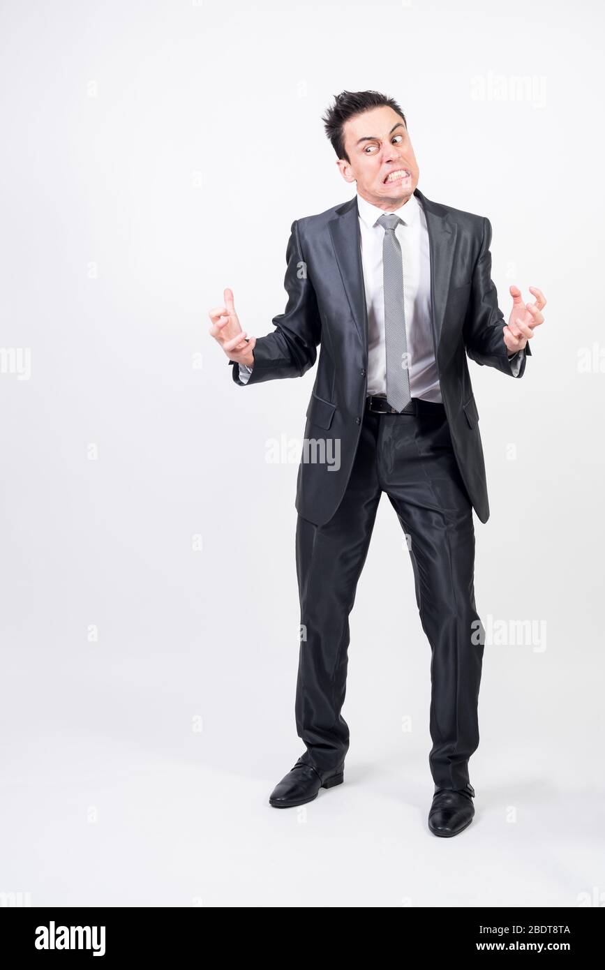 Hysterical man in suit. White background, full body Stock Photo - Alamy