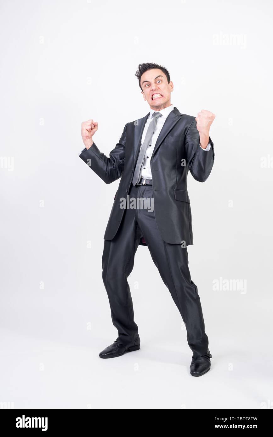 Hysterical man in suit. White background, full body Stock Photo - Alamy