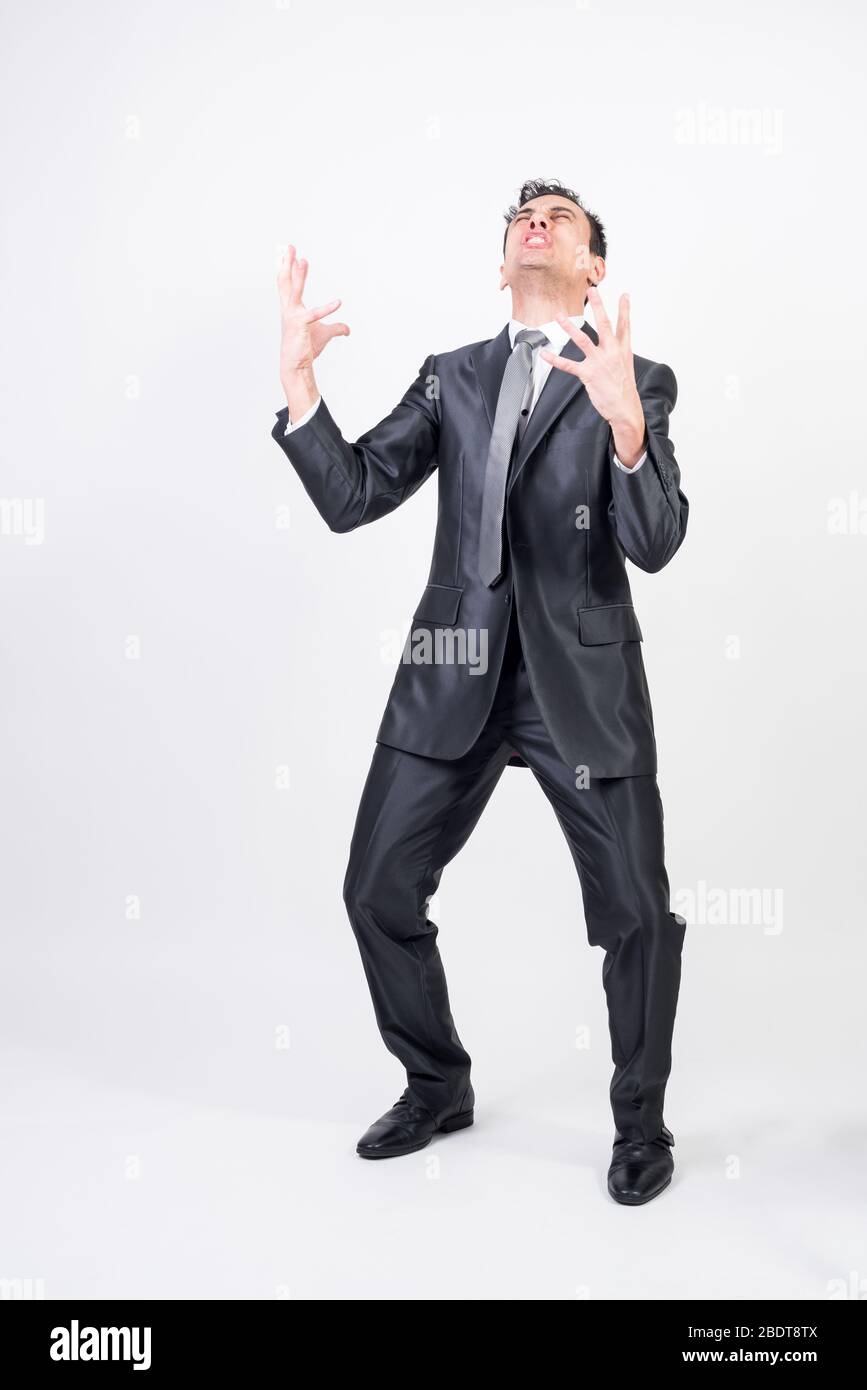 Hysterical man in suit. White background, full body Stock Photo - Alamy