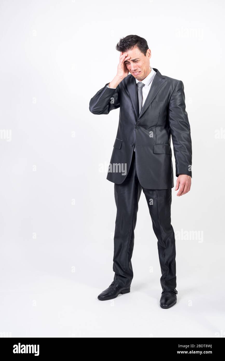 Crying man in suit. white background, full body Stock Photo - Alamy