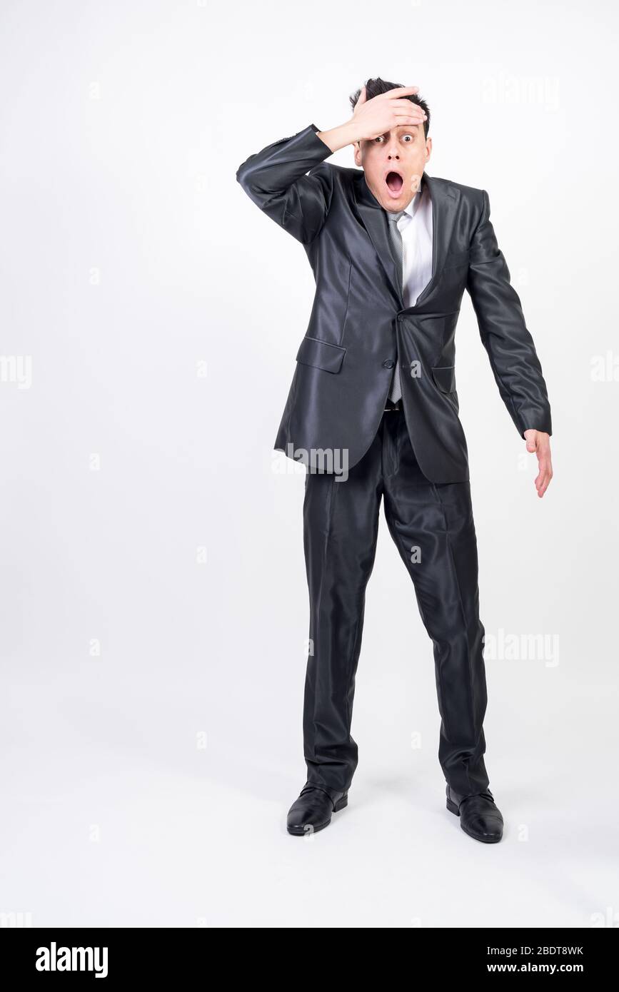 Man in suit who made a mistake. White background, full body Stock Photo ...