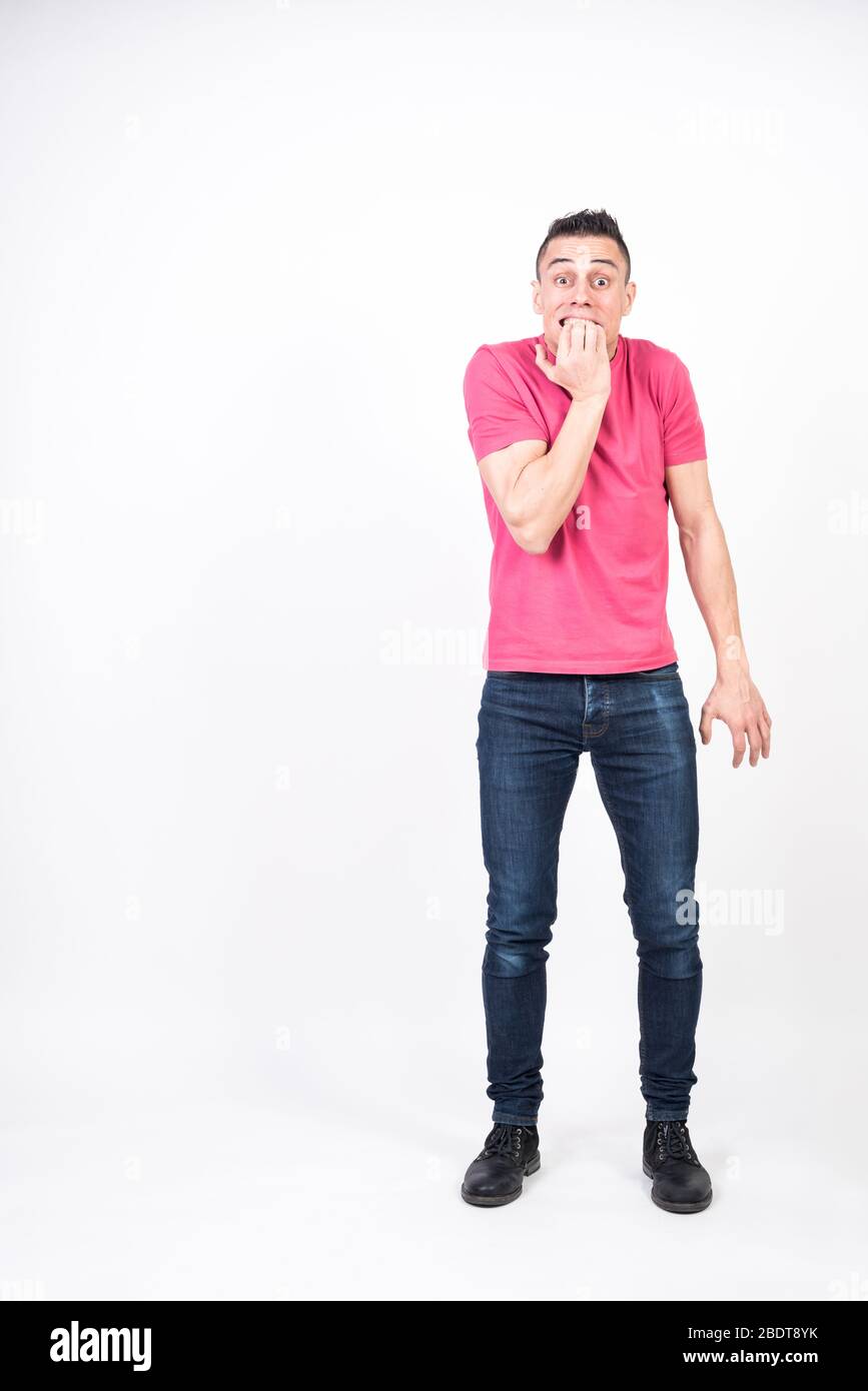 nervous man eating his nails. white background, full body Stock Photo ...