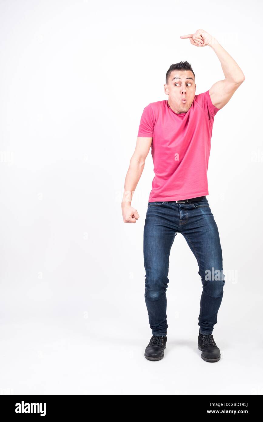 Surprised man pointing to copy space. White background, full body Stock ...