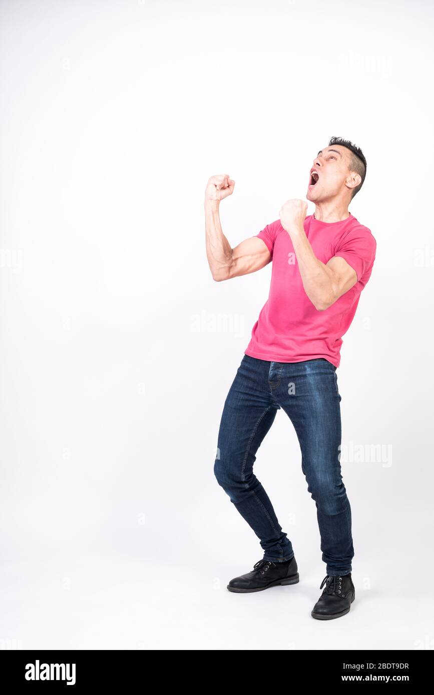 Euphoric man celebrating something. White background. Full body Stock ...