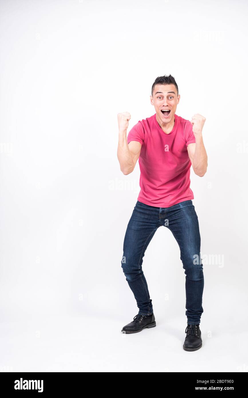 Euphoric man celebrating something. White background. Full body Stock ...