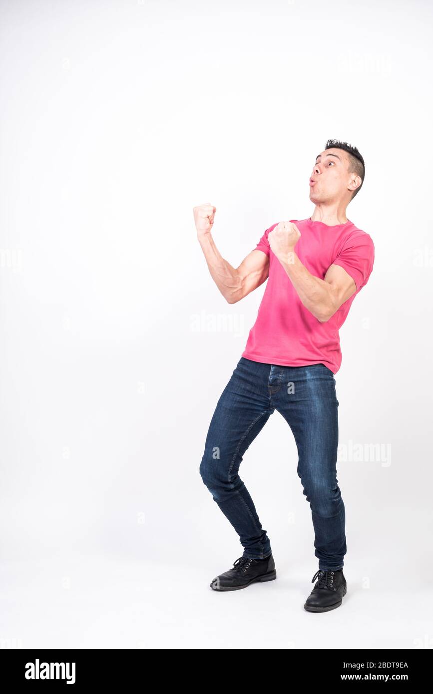 Euphoric man celebrating something. White background. Full body Stock ...