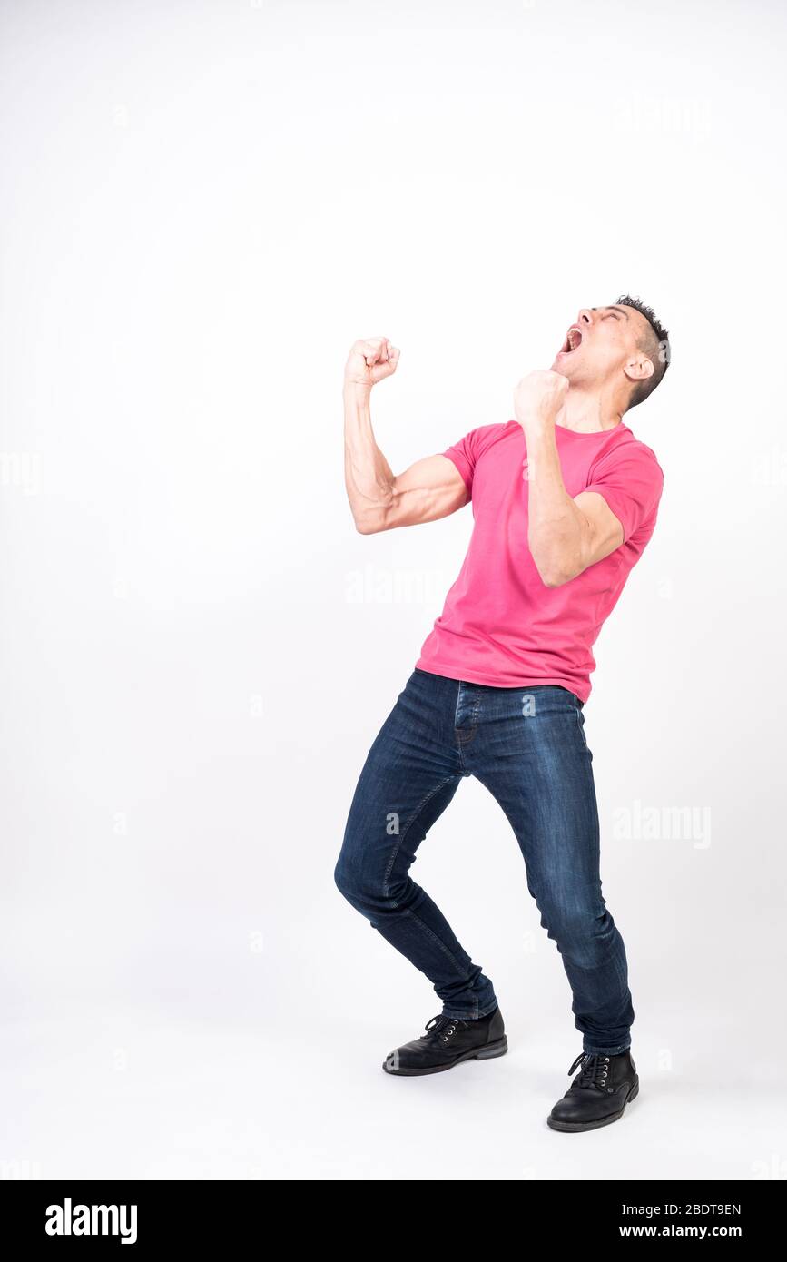 Euphoric man celebrating something. White background. Full body Stock ...