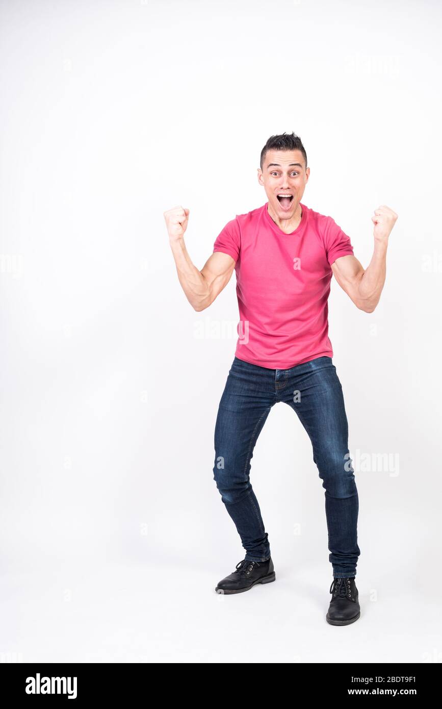Euphoric man celebrating something. White background. Full body Stock ...