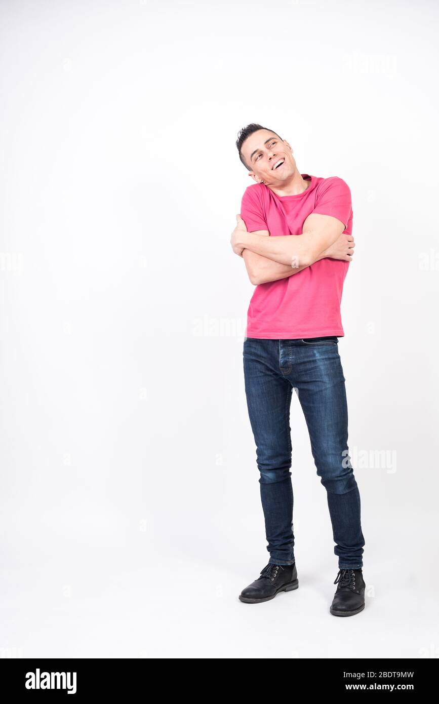 Man in love hugging himself. white background, full body Stock Photo ...