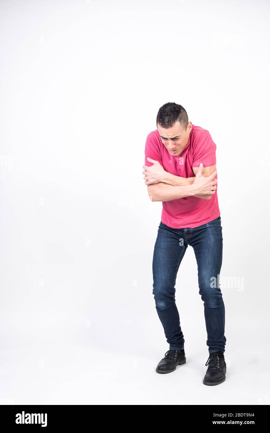 Man getting very cold surrounding his body with his arms. white ...