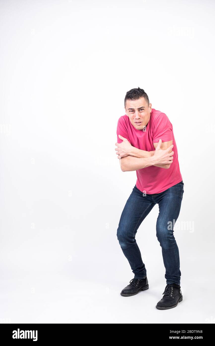 Man getting very cold surrounding his body with his arms. white ...