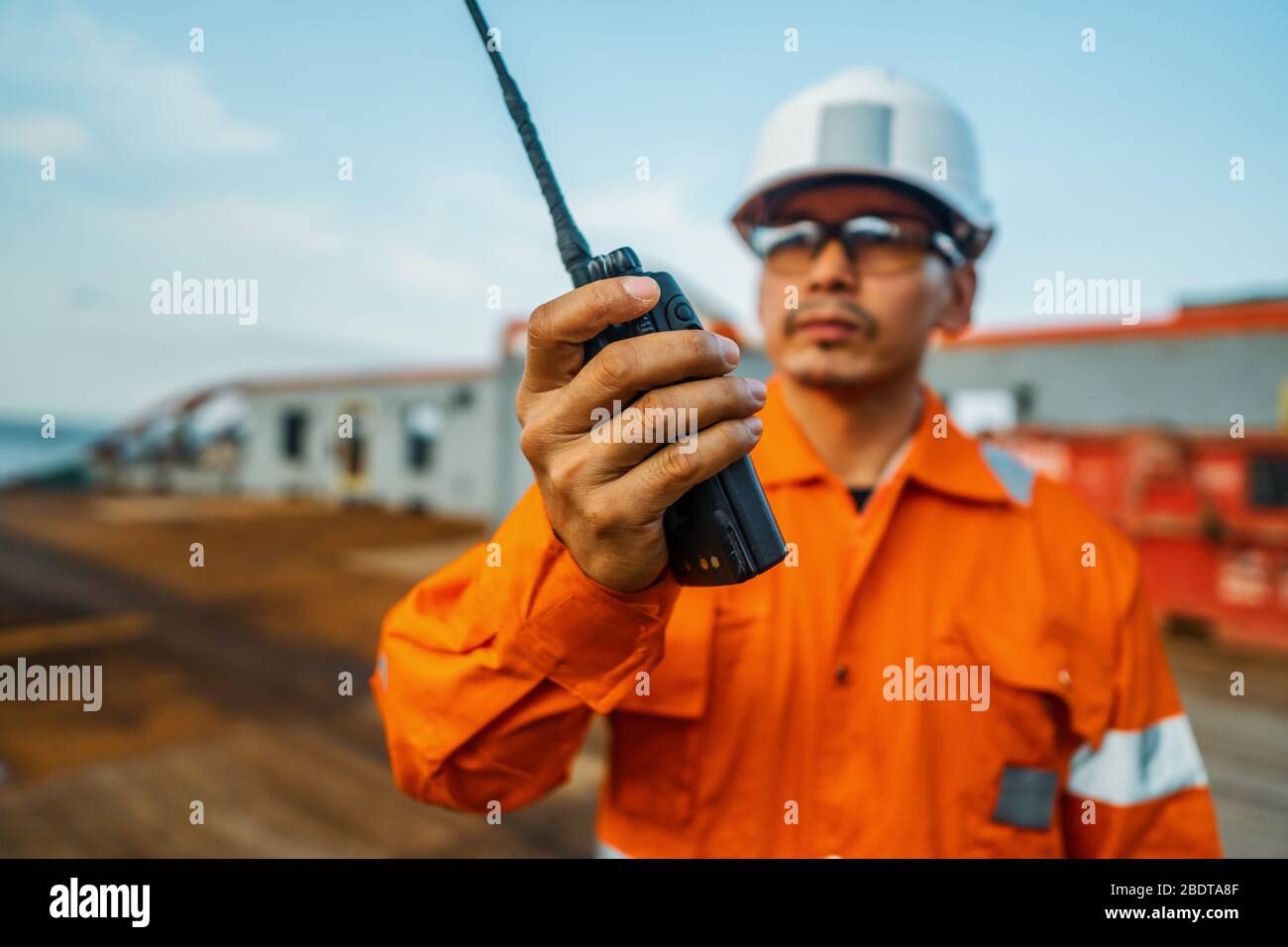 Filipino deck Officer on deck of vessel or ship , wearing PPE personal ...