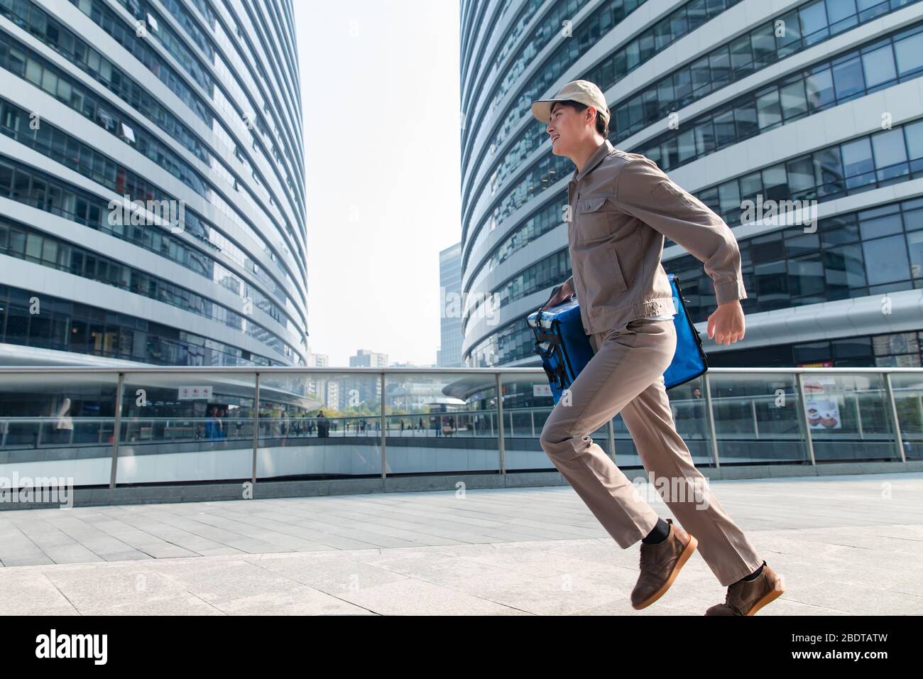 Running young take-away meals Stock Photo - Alamy