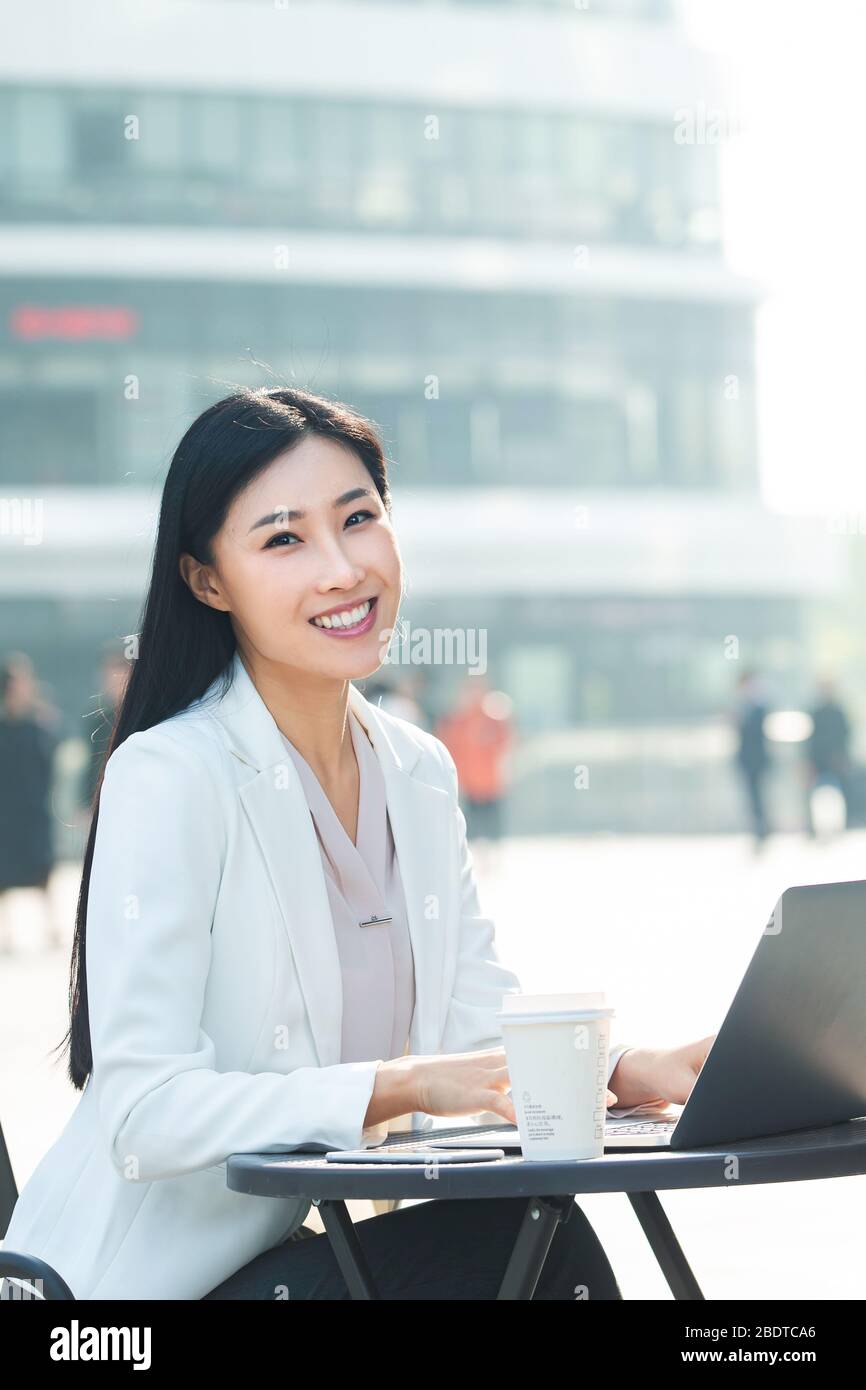 Lady sitting outside hi-res stock photography and images - Alamy