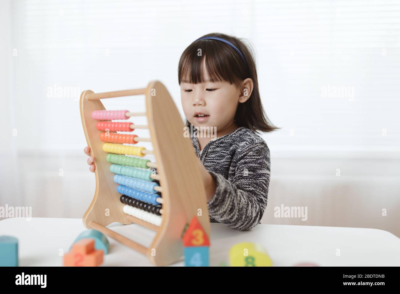 toddler girl learn counting by using abacus for homeschooling Stock ...