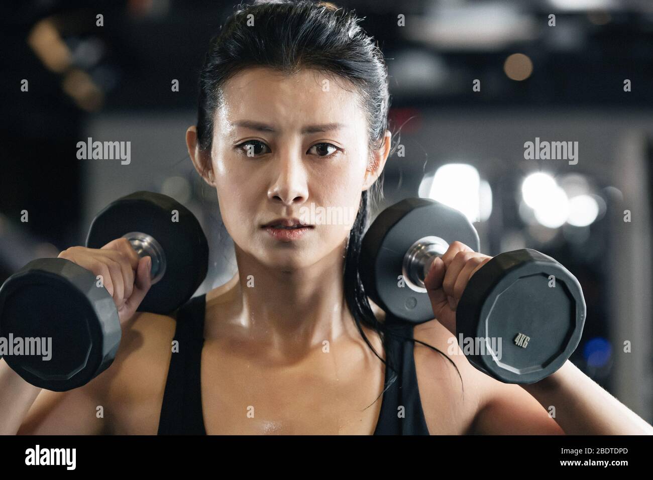 Indian woman exercising dumbbell hi-res stock photography and images ...