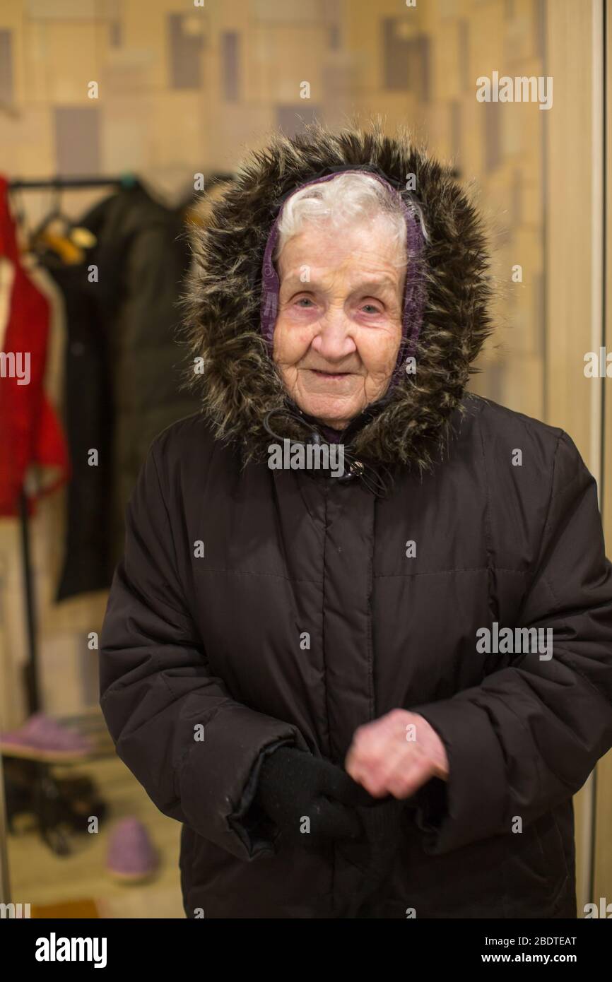 Old woman wearing winter outerwear Stock Photo - Alamy