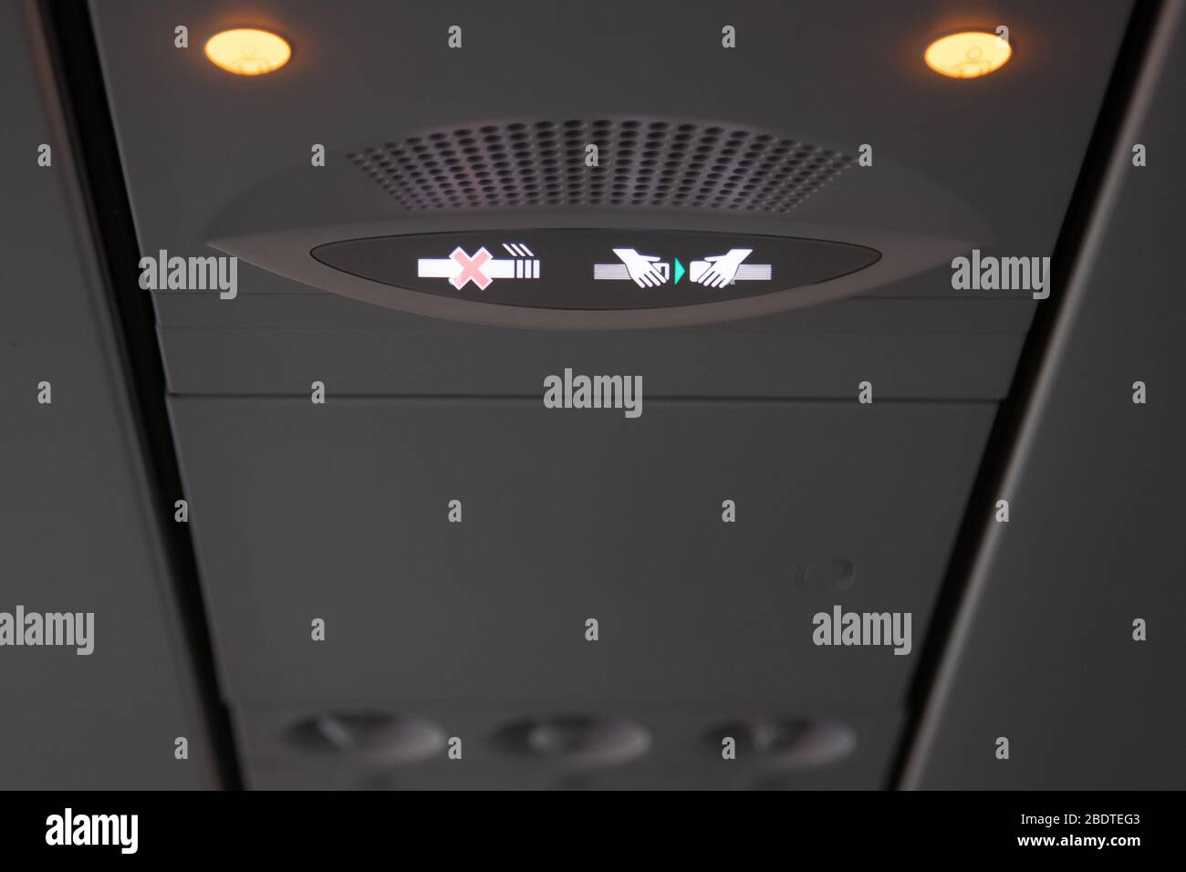 Smoking and seat belt in a airplane plane ceiling interior Stock Photo ...